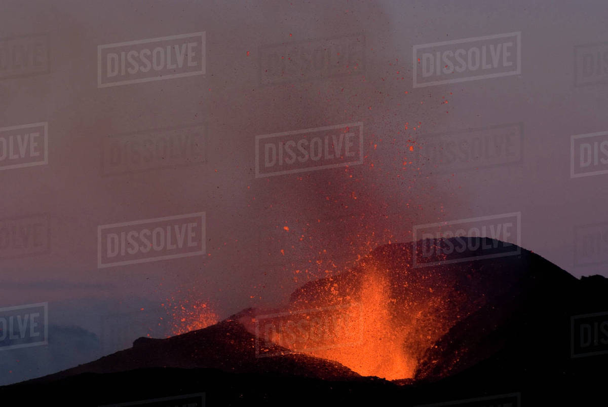 Lava from a volcano at sunset - Royalty-free Stock Photo | Dissolve
