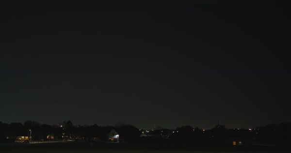 Shot of dark night sky over city, suburb, car diving by left, 4K ...