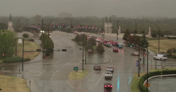 Wide shot of city traffic on wet street, rain, day, high angle, 4K ...