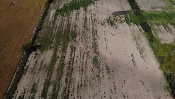 Barren farm fields with no crops drone shot. Aerial of empty farmer's ...