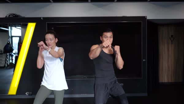 Asian man and woman boxing training. Chinese male and female team doing ...