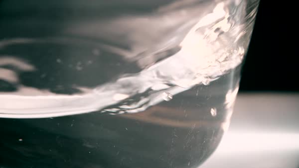 Stirring clear transparent liquid in slow motion - Stock Video Footage ...
