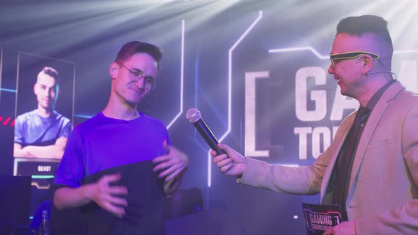 Nerdy gamer giving interview during gaming tournament - Stock Video ...