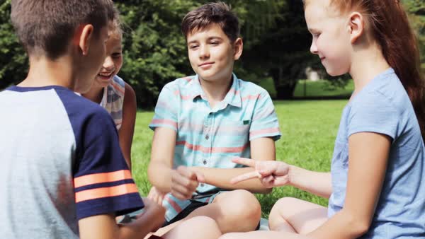 Happy kids playing rock-paper-scissors game - Stock Video Footage ...