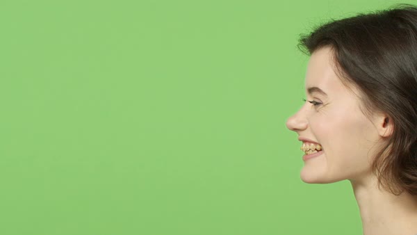 Slow-motion profile portrait of happy, sincere and enthusiastic lovely ...