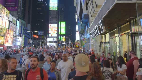 Point-of-view shot of crowd of people on street at night, New York City ...