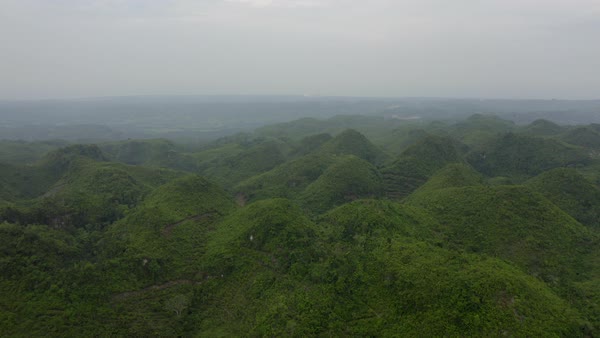 Drone shot of tree covered mountains against sky, Cebu City ...