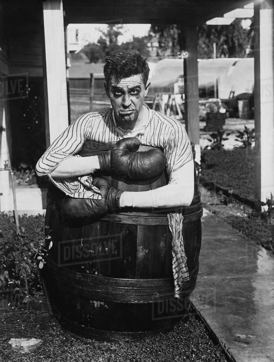 Defeated boxer in barrel outside - Royalty-free Stock Photo | Dissolve