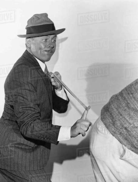 Man snapping rear end with rubber band - Royalty-free Stock Photo ...