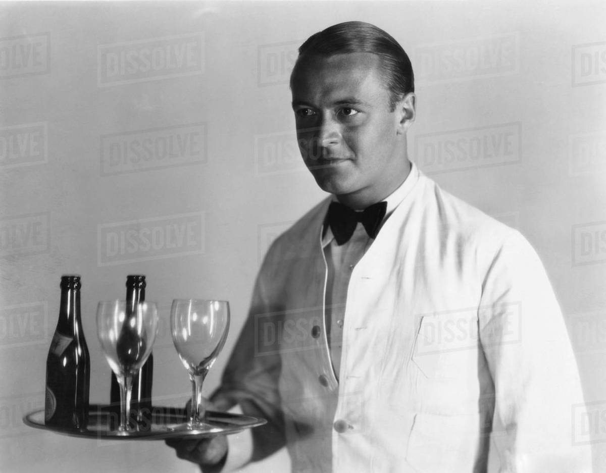 Waiter with beverages on tray - Royalty-free Stock Photo | Dissolve