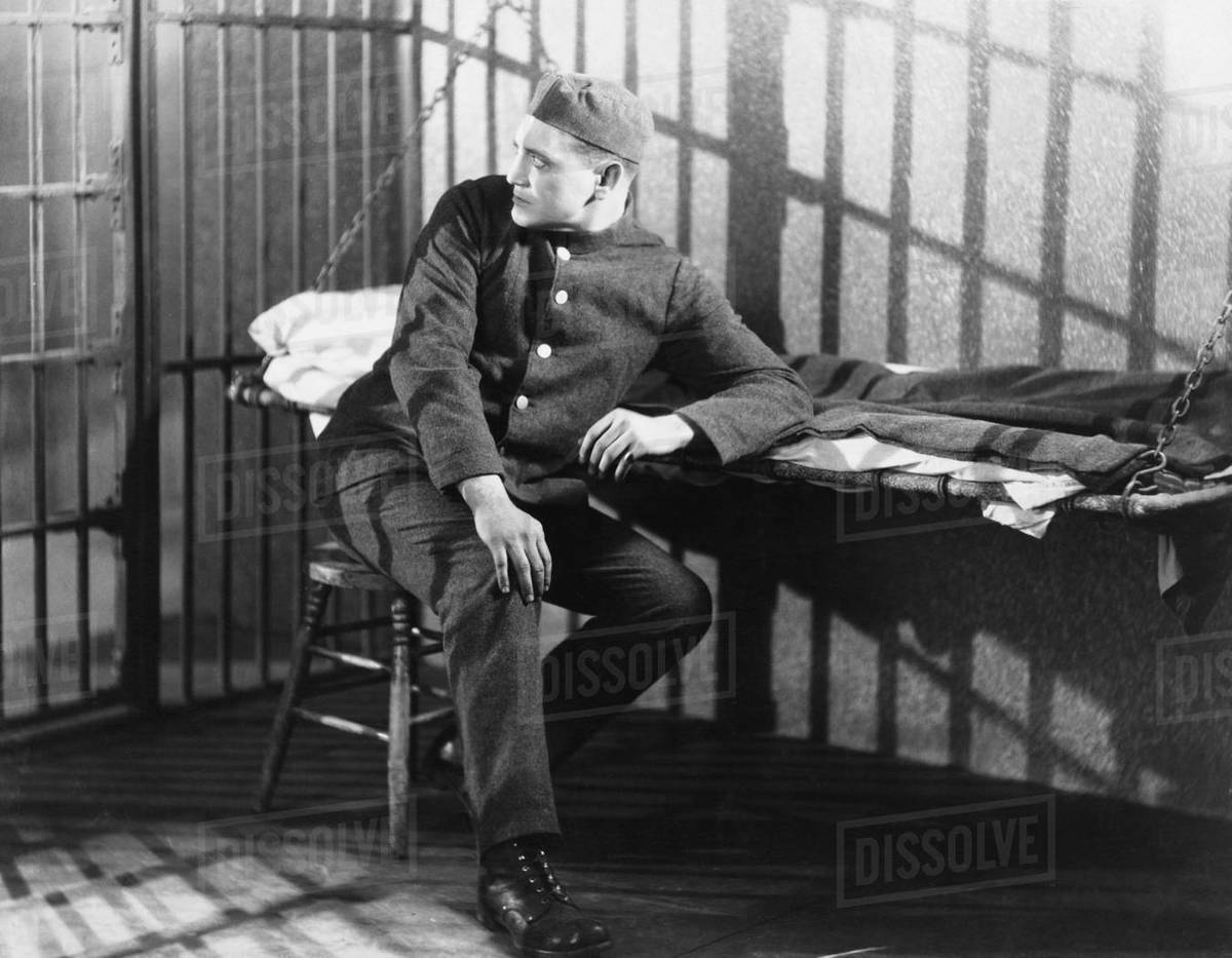 Man in prison cell - Royalty-free Stock Photo | Dissolve