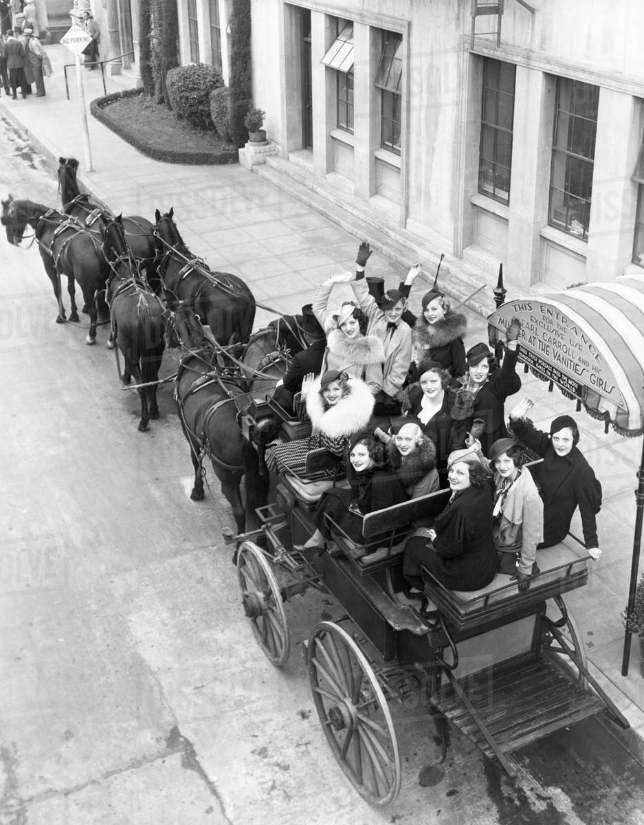Group of women in horse drawn carriage - Stock Photo - Dissolve