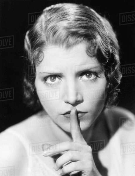 Closeup of woman shushing - Royalty-free Stock Photo | Dissolve