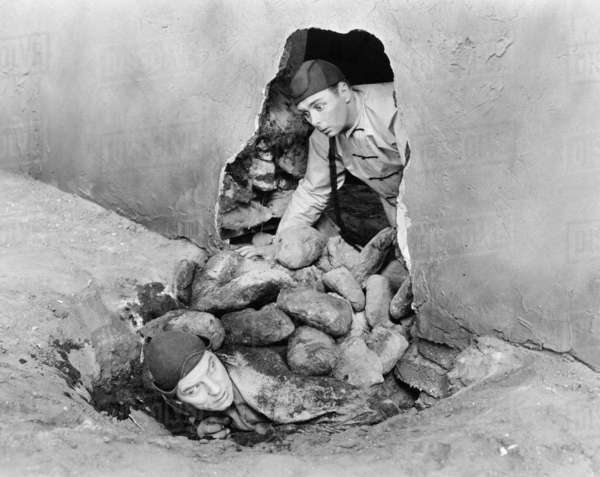 Two men crawling out of a hole in a wall - Royalty-free Stock Photo ...