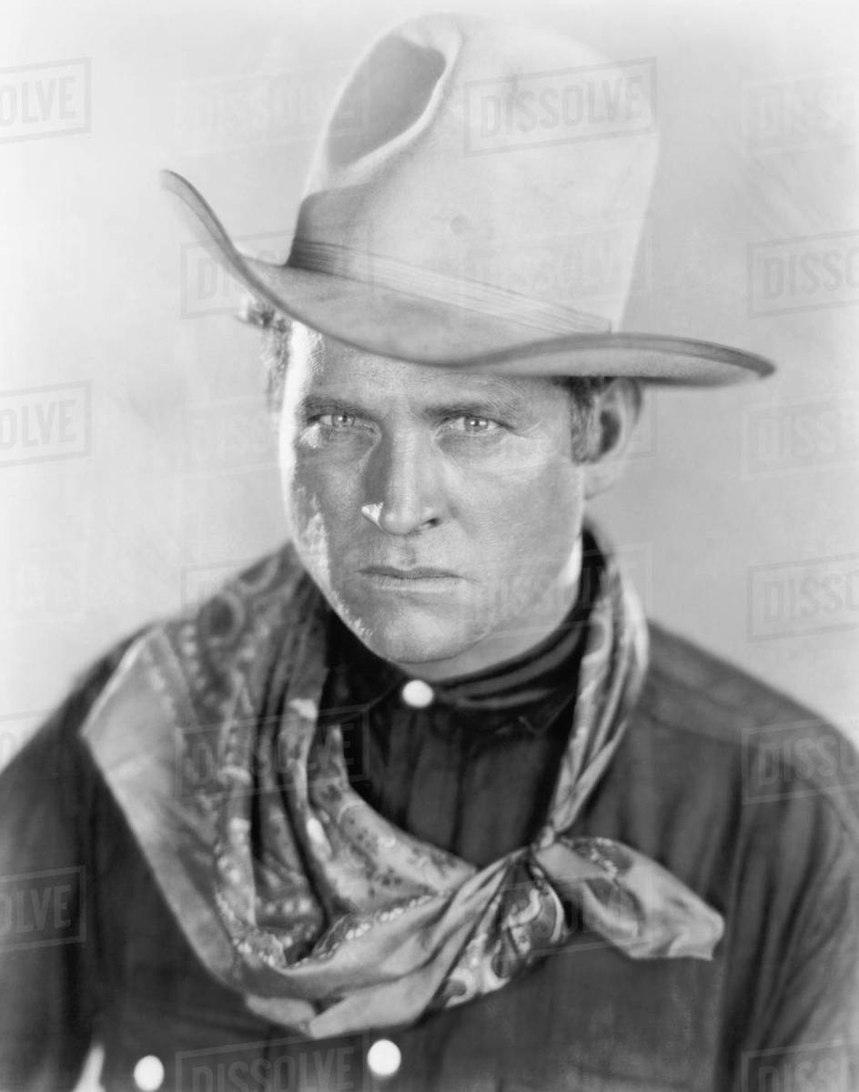 Cowboy with a hat looking sternly at the camera - Royalty-free Stock ...