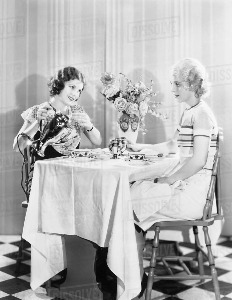 Two women having tea together - Royalty-free Stock Photo | Dissolve