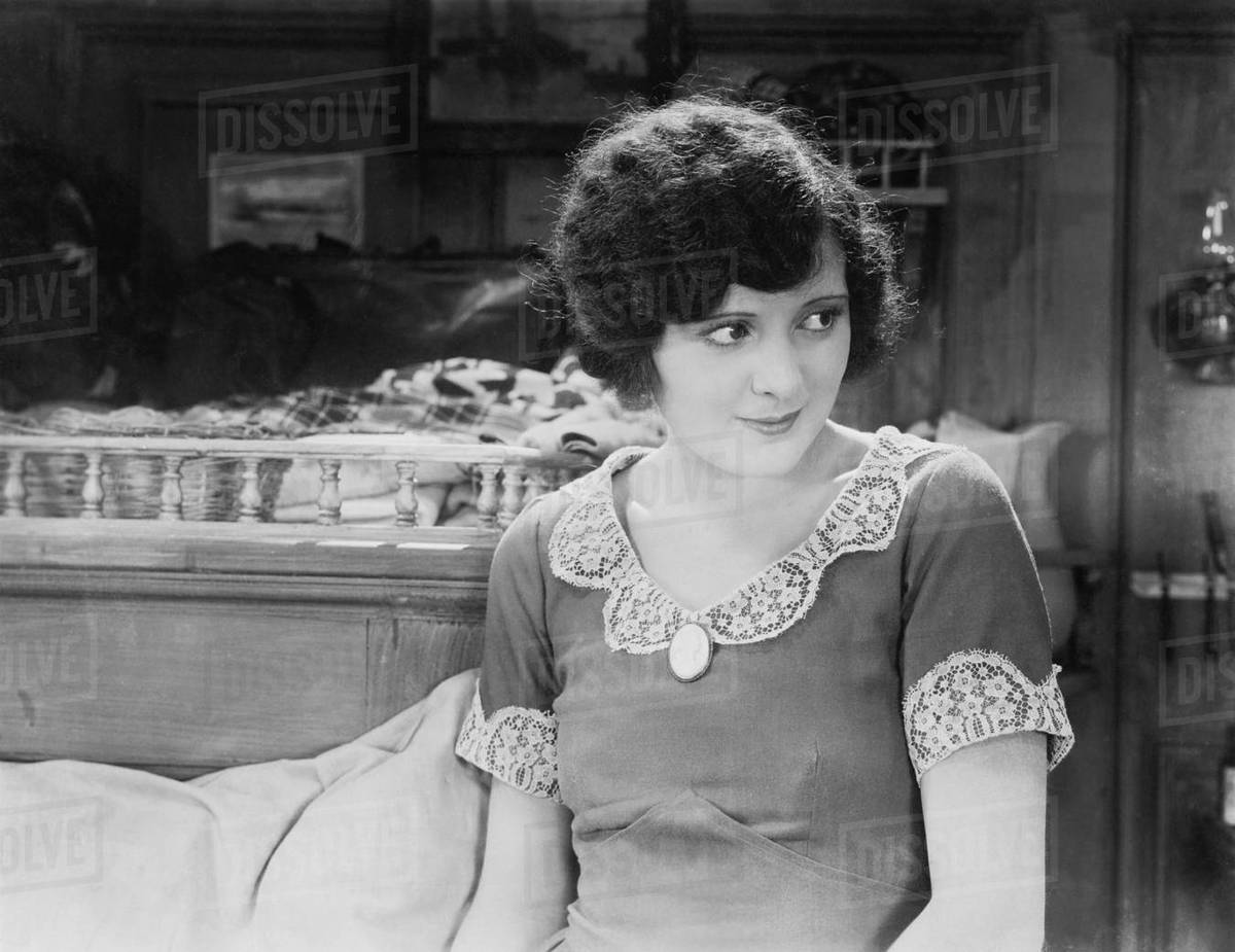 Woman looking coy - Royalty-free Stock Photo | Dissolve