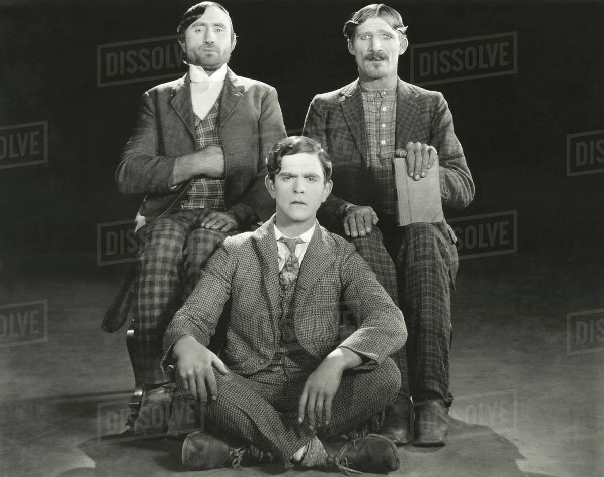 Three men posing in their Sunday best - Royalty-free Stock Photo | Dissolve
