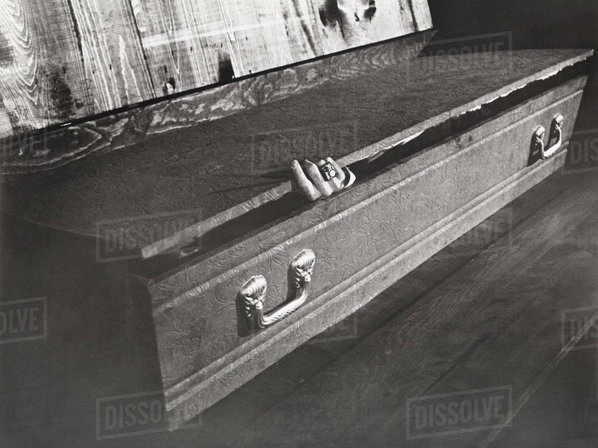 Hand reaching out of coffin - Royalty-free Stock Photo | Dissolve