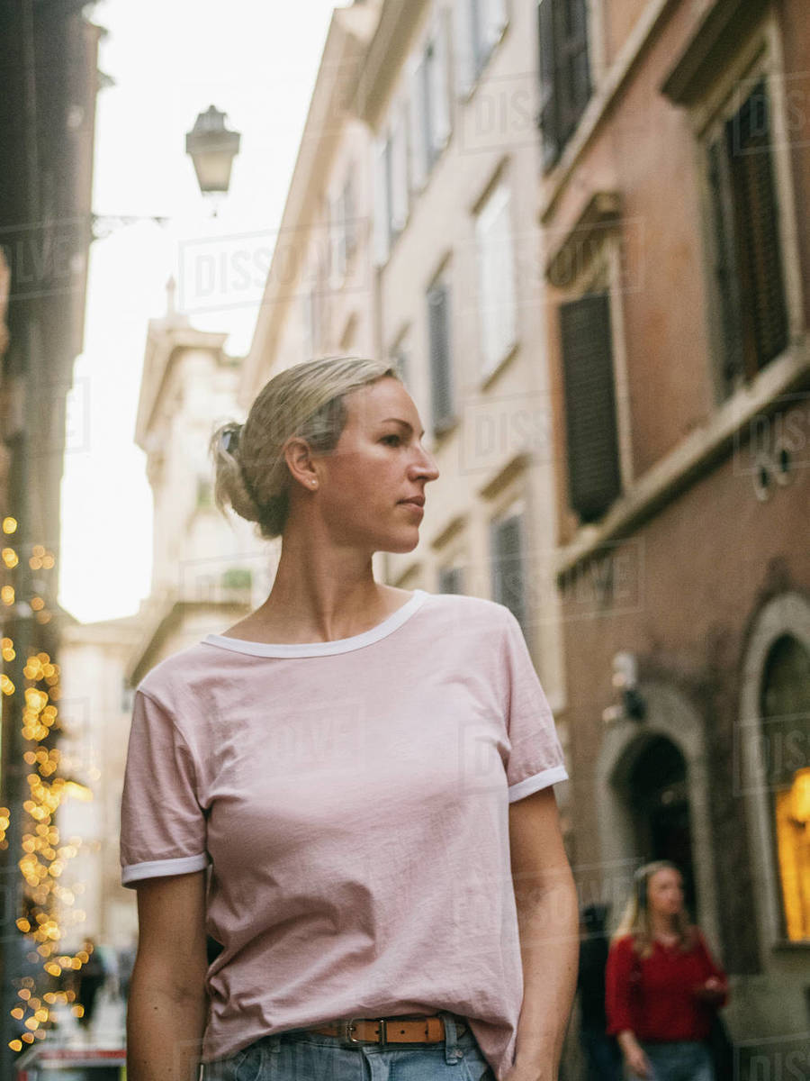 Woman looking off camera in Rome - Royalty-free Stock Photo | Dissolve