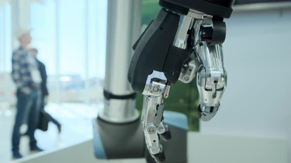 New technologies among us. The robot's hand rotates and moves. The palm ...
