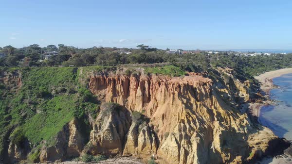 Forward flight towards and over Red Bluff lookout rising high to reveal ...