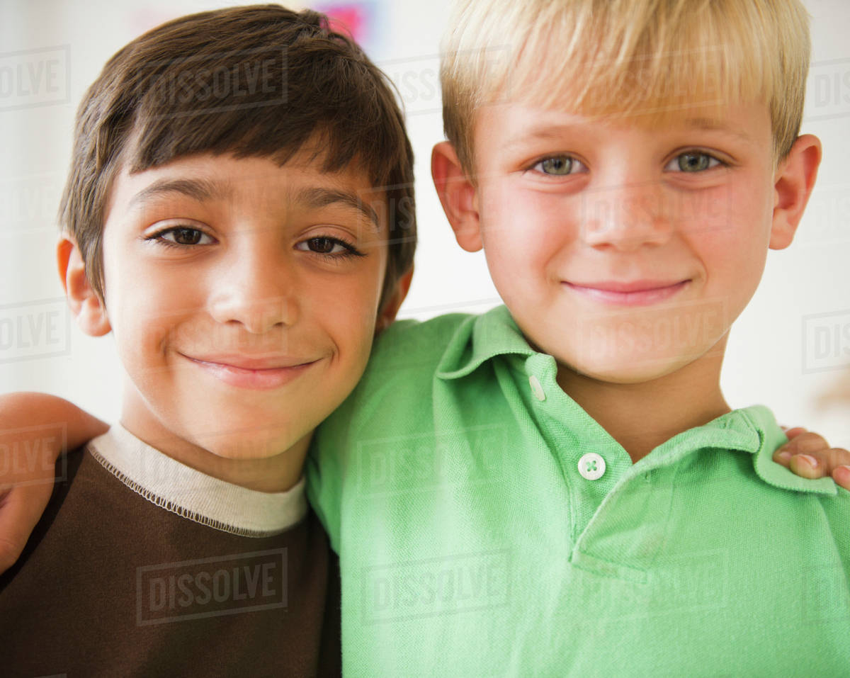 Smiling boys hugging - Royalty-free Stock Photo | Dissolve