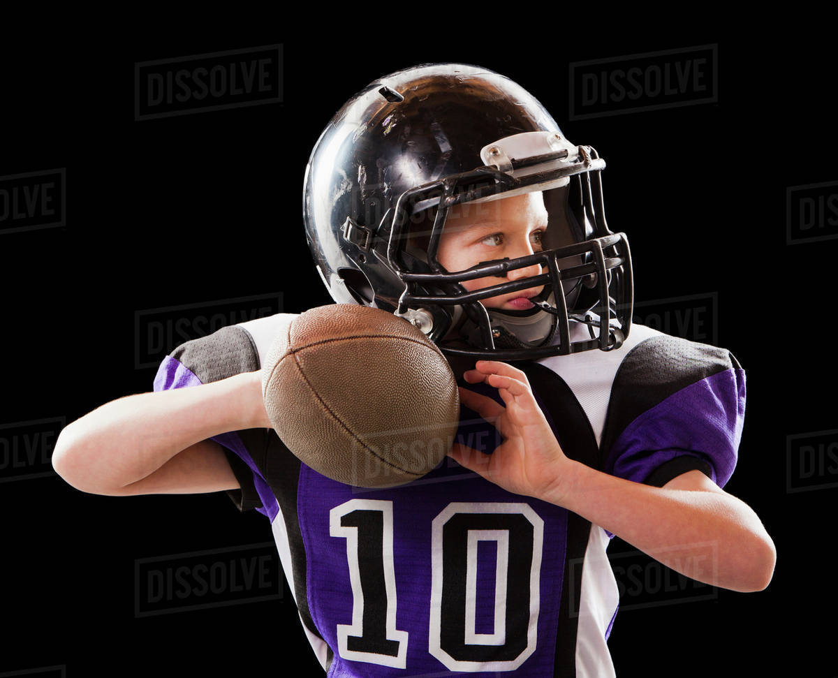 Caucasian football player throwing football - Royalty-free Stock Photo ...