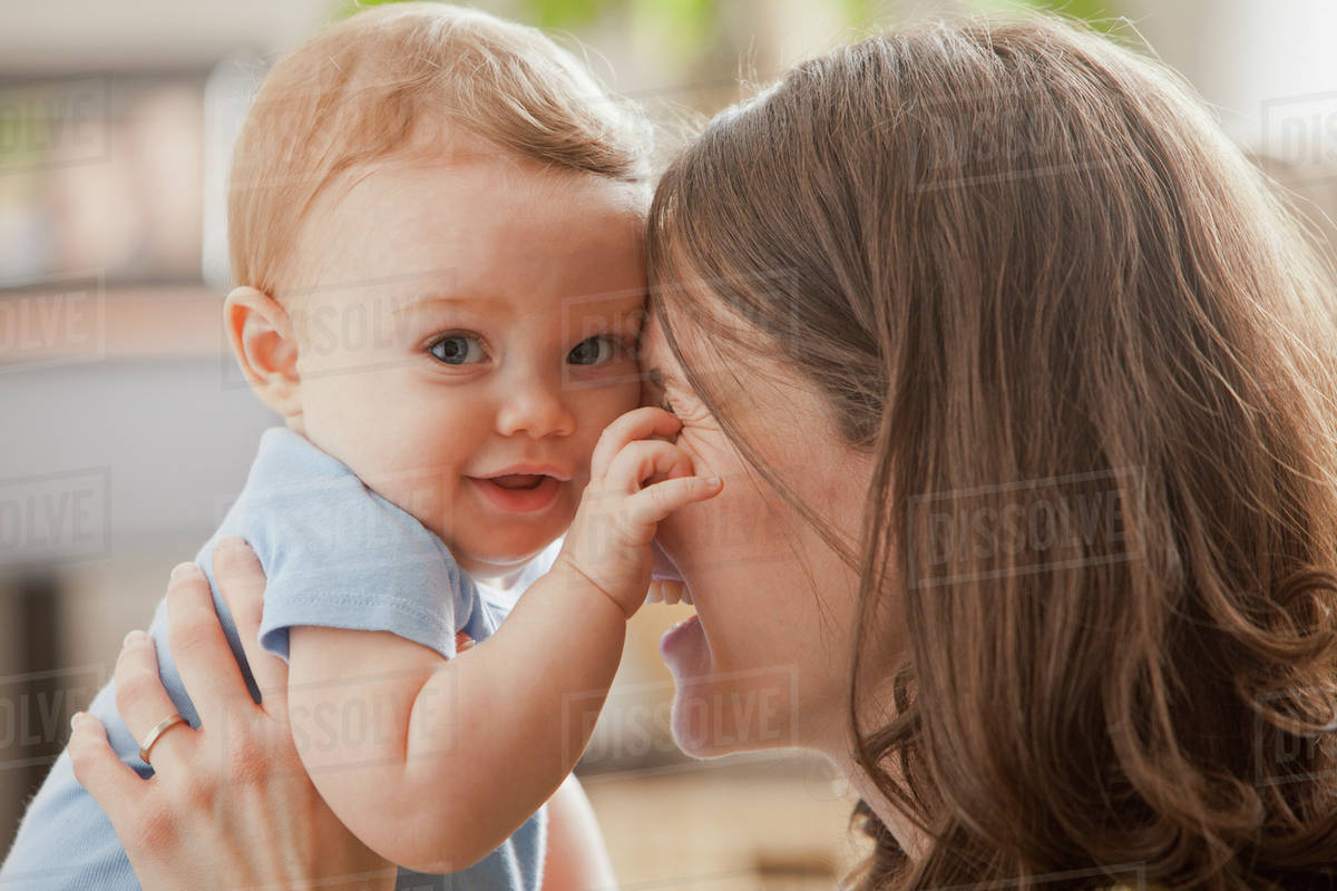Caucasian mother hugging baby boy - Stock Photo - Dissolve
