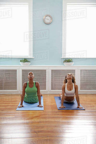 Black women practicing yoga - Royalty-free Stock Photo | Dissolve