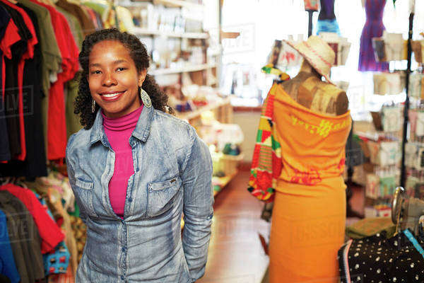 Black woman standing in store - Royalty-free Stock Photo | Dissolve