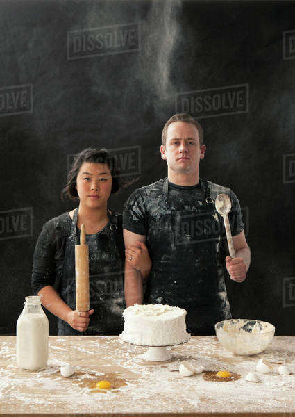 Messy couple baking cake - Royalty-free Stock Photo | Dissolve
