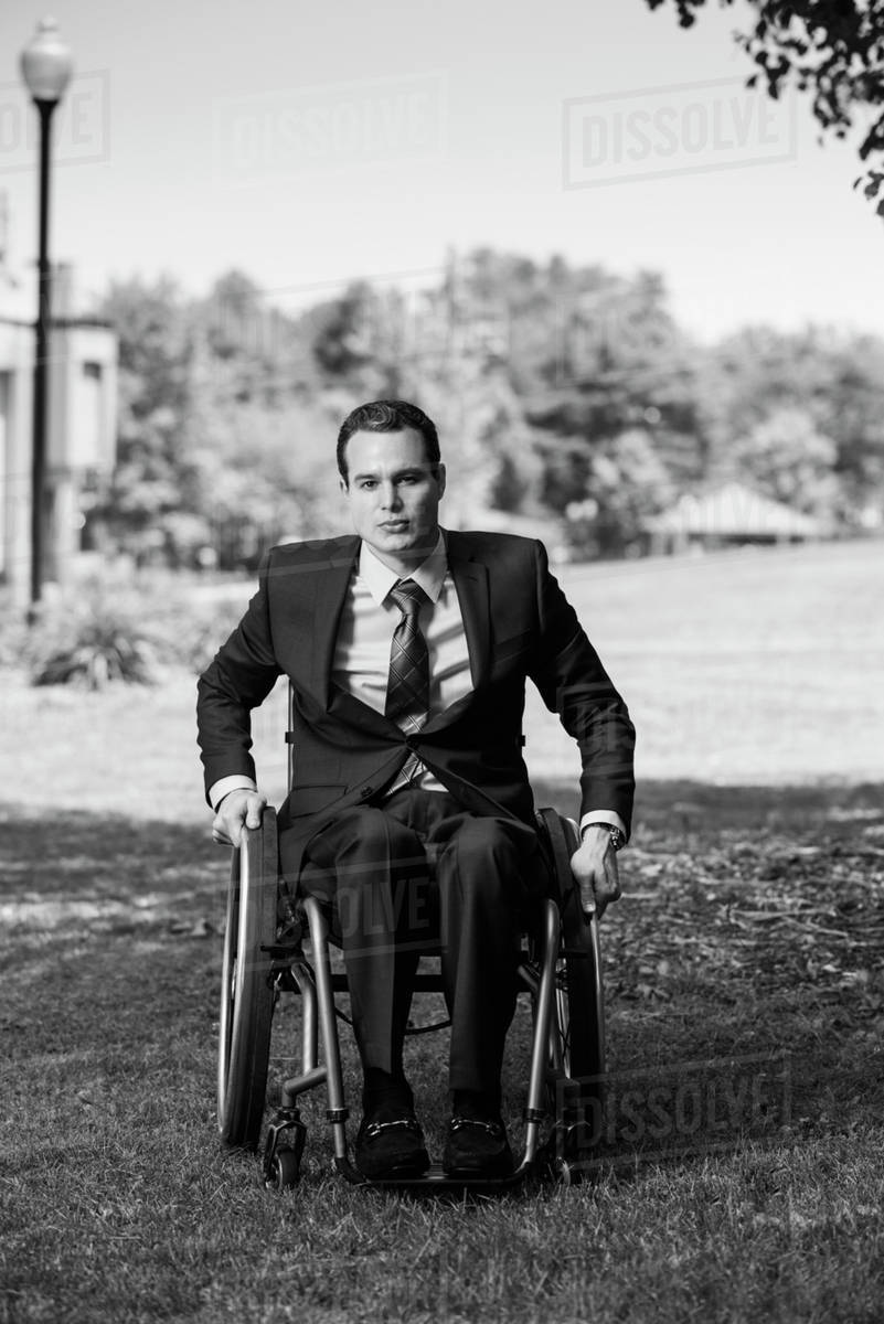Paraplegic businessman in wheelchair in park - Royalty-free Stock Photo ...