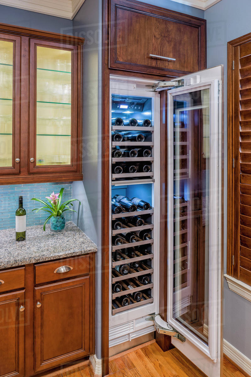 Open bottle cooler in modern kitchen - Royalty-free Stock Photo | Dissolve