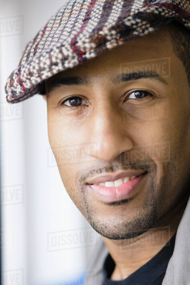 African American man wearing cap - Royalty-free Stock Photo | Dissolve