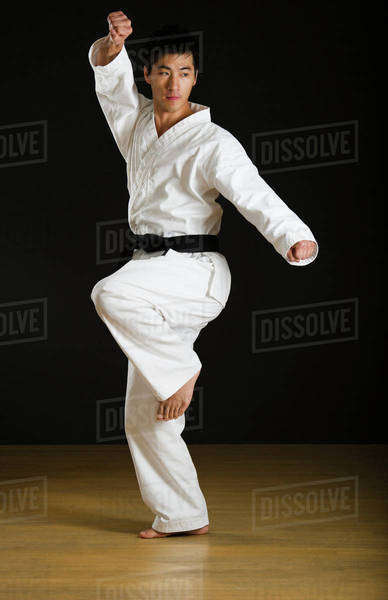 Asian male black belt practicing karate - Royalty-free Stock Photo ...