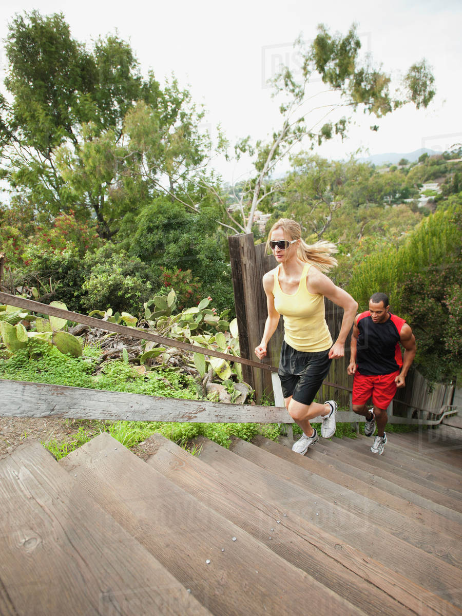 People running up stairs for exercise - Royalty-free Stock Photo | Dissolve