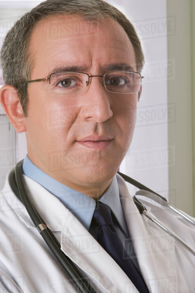 Serious Hispanic doctor - Royalty-free Stock Photo | Dissolve