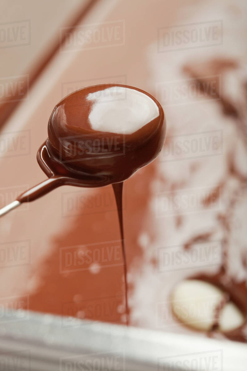 Candy dripping chocolate - Stock Photo - Dissolve