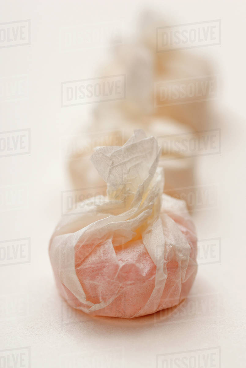 Close up of candy in wrapped paper - Royalty-free Stock Photo | Dissolve
