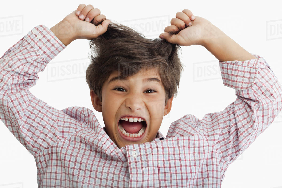 Screaming Hispanic boy - Stock Photo - Dissolve