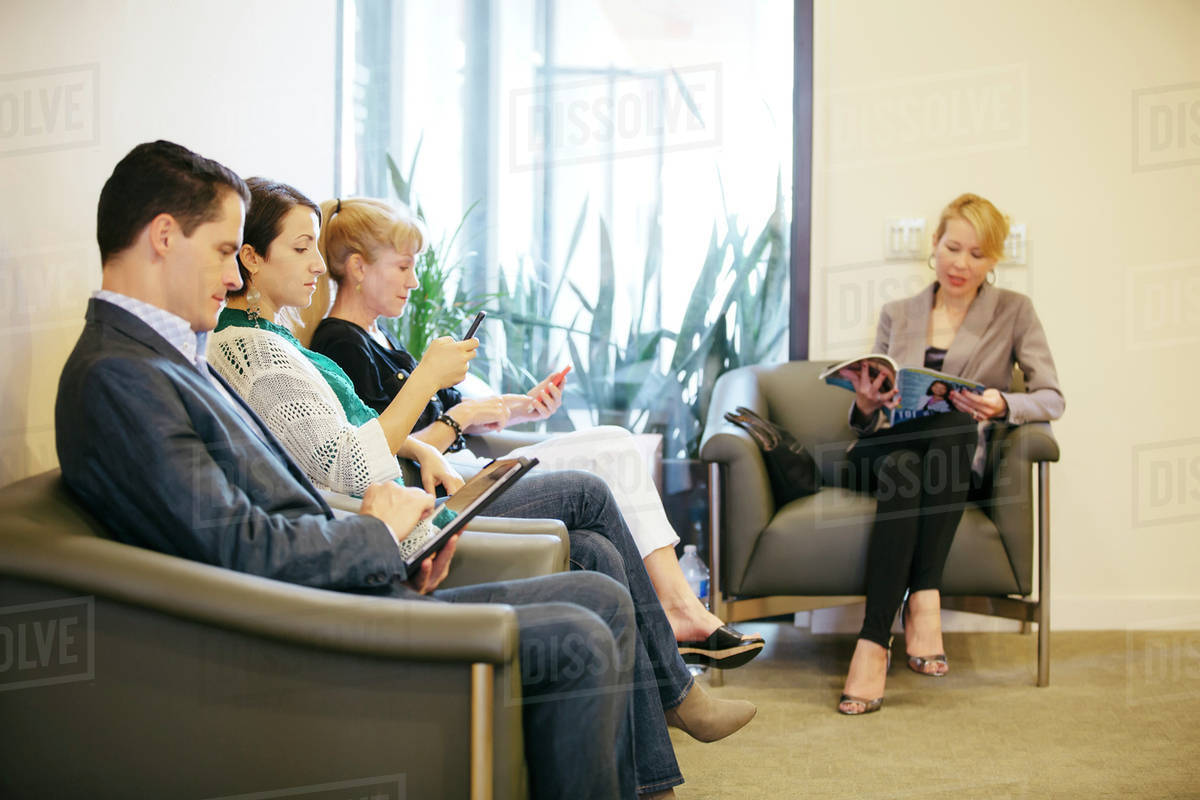 Business people waiting in office lobby - Royalty-free Stock Photo ...