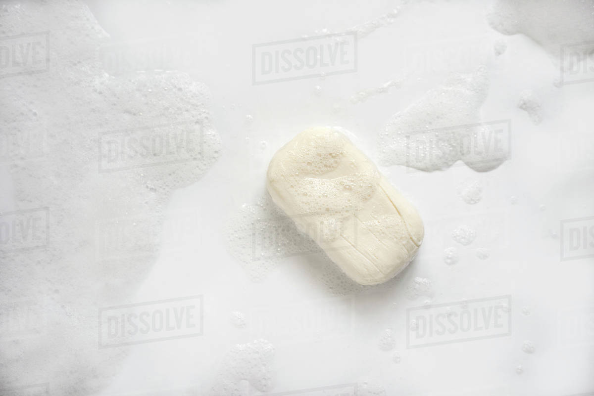 Bar of soap on floor - Stock Photo - Dissolve