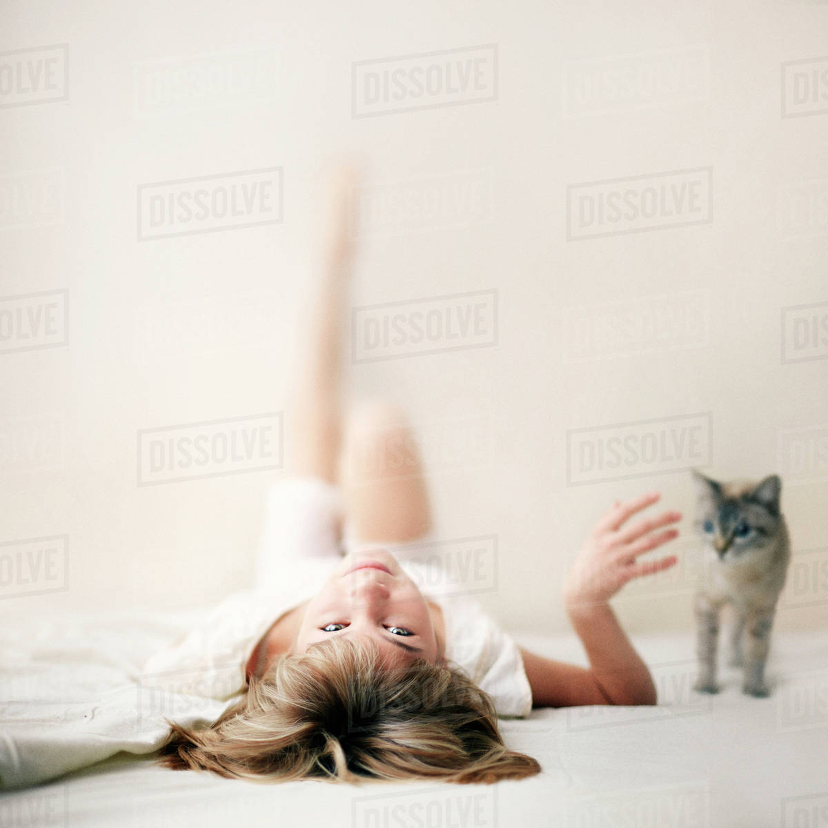 Caucasian girl laying on floor - Royalty-free Stock Photo | Dissolve