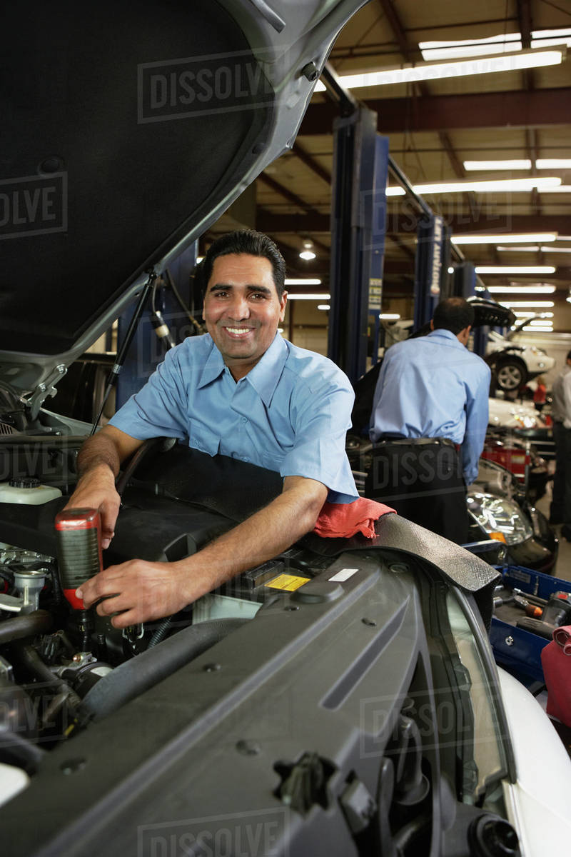 Indian male auto mechanic in shop - Royalty-free Stock Photo | Dissolve