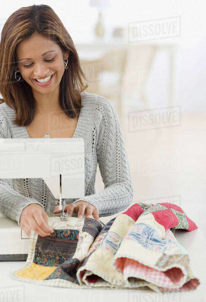 Indian woman sewing - Royalty-free Stock Photo | Dissolve