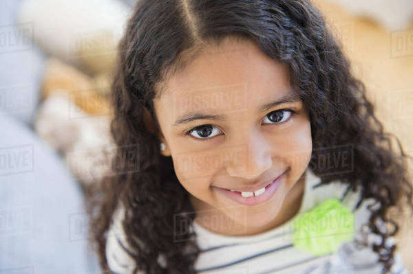 Close up of mixed race girl smiling - Royalty-free Stock Photo | Dissolve