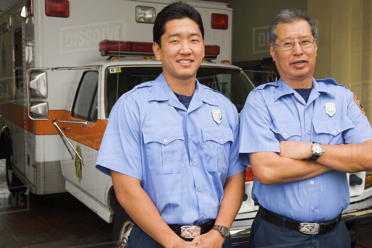 Asian male paramedics in front of ambulance - Royalty-free Stock Photo ...