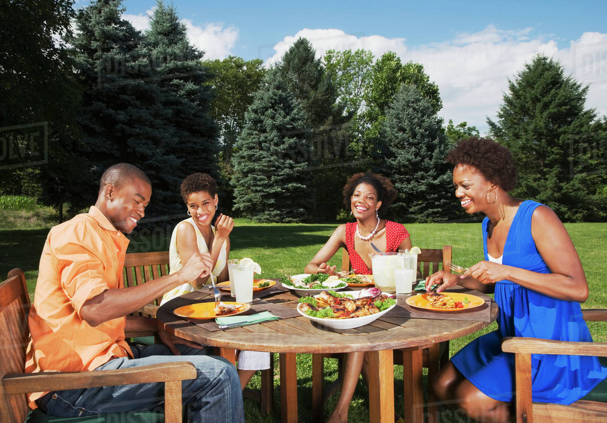 African American friends eating outdoors - Royalty-free Stock Photo ...