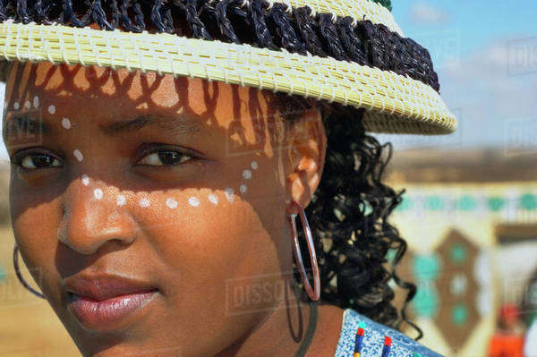 African woman with paint on face - Royalty-free Stock Photo | Dissolve